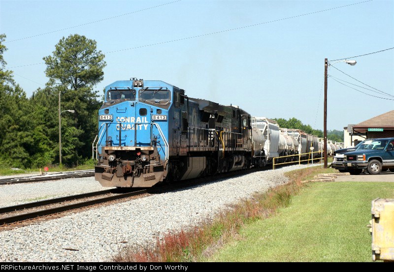 NS 8413 has train 338 drops of a cut of tank and covered hoppers on 5-18-06
